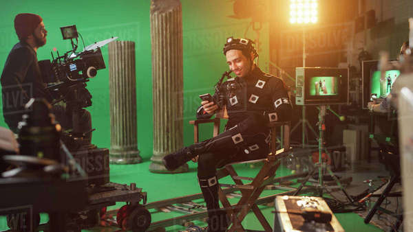 Handsome Smiling Actor Wearing Motion Capture Suit and Head Rig having ...