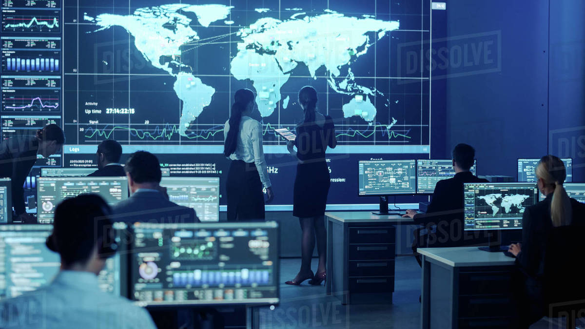 Project Manager and Computer Science Engineer Talking while Using Big Screen Display Showing ...