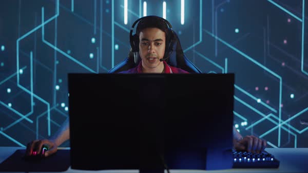 Professional eSports Gamer Playing in Computer Video Games. Background ...