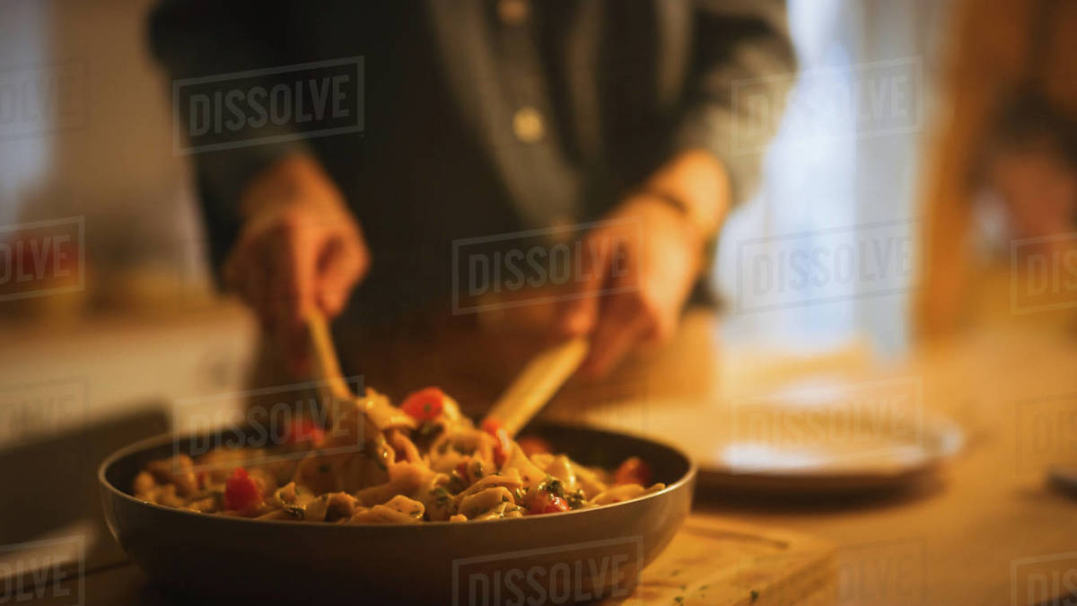 Person Serving Delicious Looking Pasta on the Plate. Serving ...