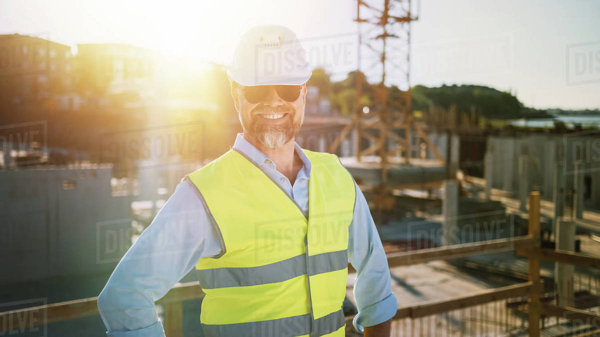 Confident Bearded Head Civil Engineer-Architect in Sunglasses is Smiling on Camera in a ...