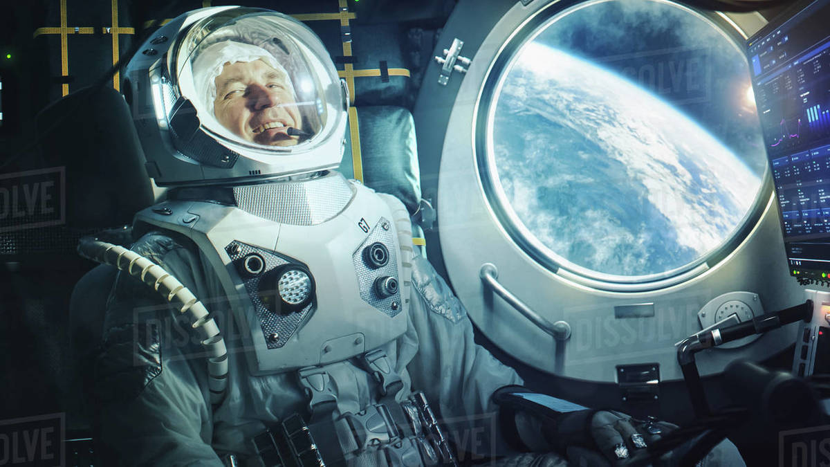 Portrait of a Happy Astronaut on a Space Ship In Orbit. Cosmonaut in a ...