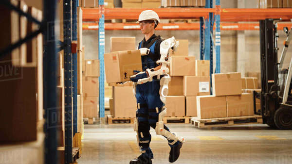 High-Tech Futuristic Warehouse: Worker Wearing Advanced Full Body ...