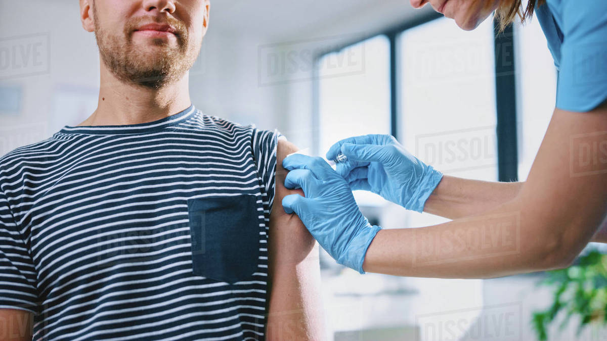 Medical Nurse Injecting Vaccine to a Patient in a Health Clinic ...