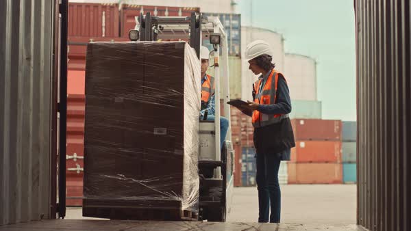 Forklift Driver Loading a Shipping Cargo Container - Stock Video ...