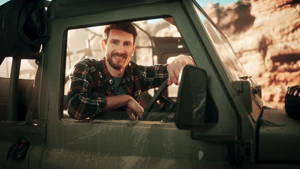 Desert Road Trip: Portrait of Handsome Male Explorer Looking out of Car ...