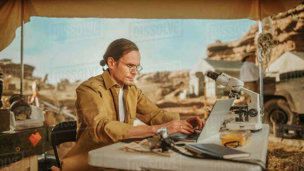 Male Archaeologist Doing Research - Royalty-free Stock Photo | Dissolve