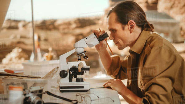 Male Archaeologist Doing Cultural Research - Stock Photo - Dissolve
