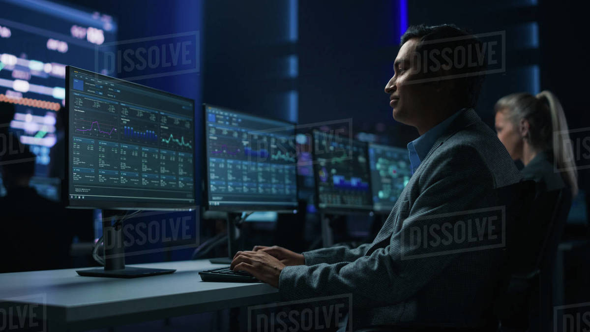 Confident Male Data Scientist Works on Personal Computer in Big ...