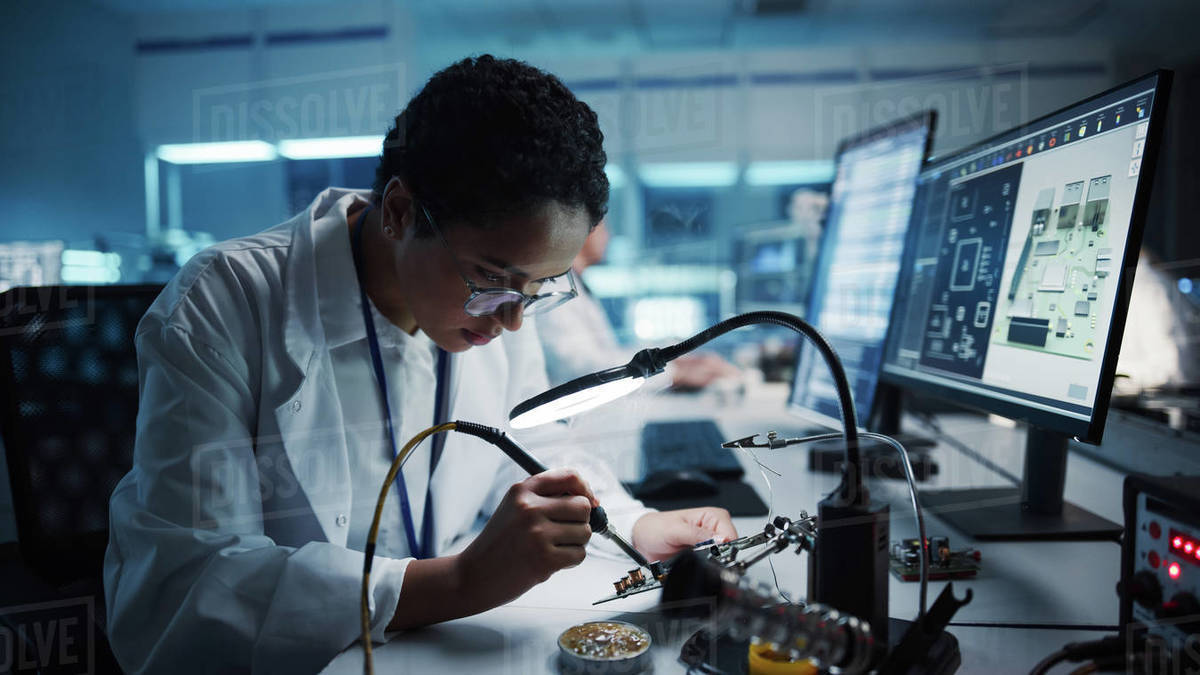 Black Female Engineer Does Computer Motherboard Soldering - Royalty ...