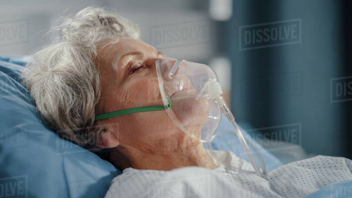 Portrait of Elderly Woman Wearing Oxygen Mask Sleeping in Bed - Royalty ...