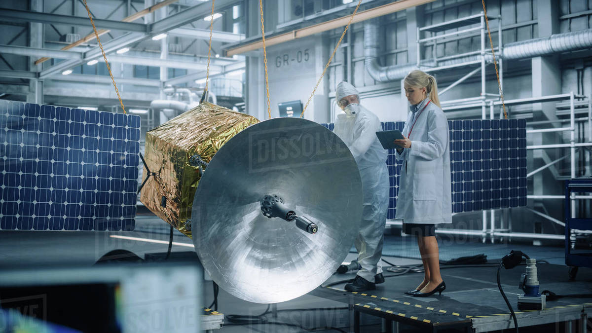 Female Chief Engineer talk to Technician while he is Working on ...