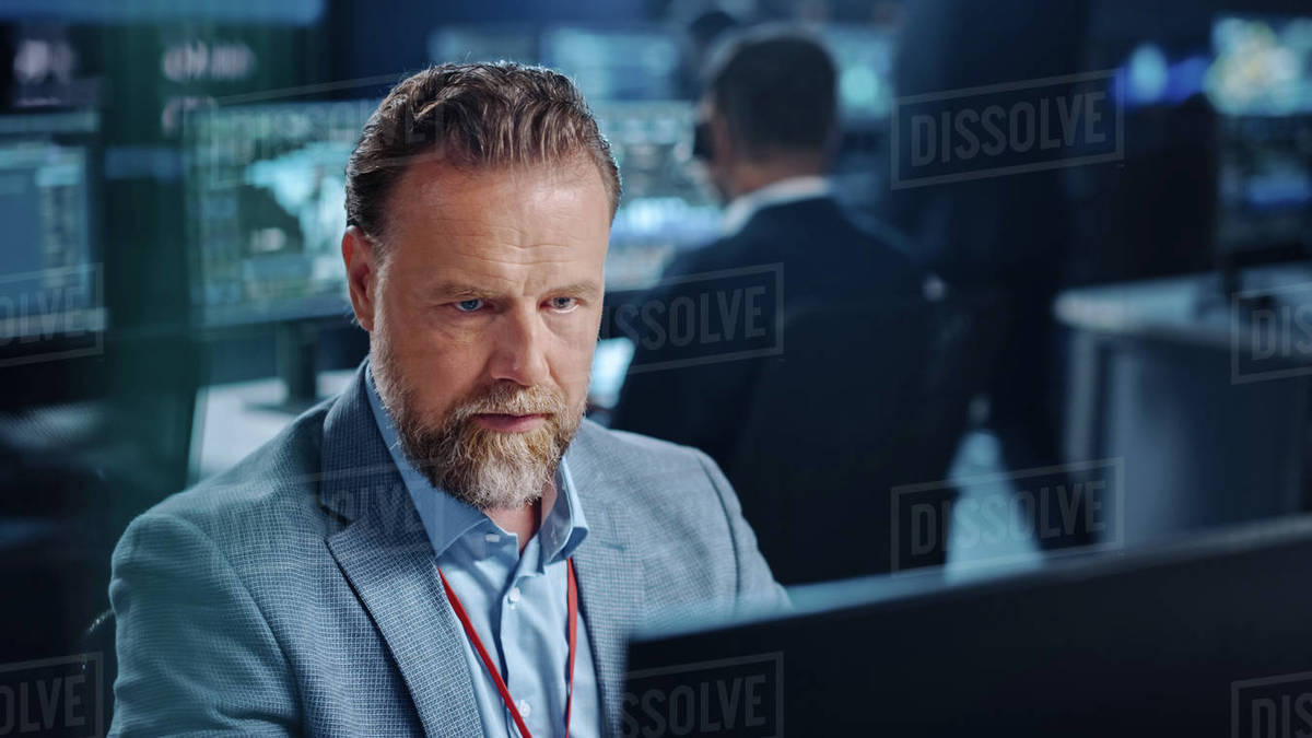 Portrait of Serious Professional Technical Controller Sitting at His ...