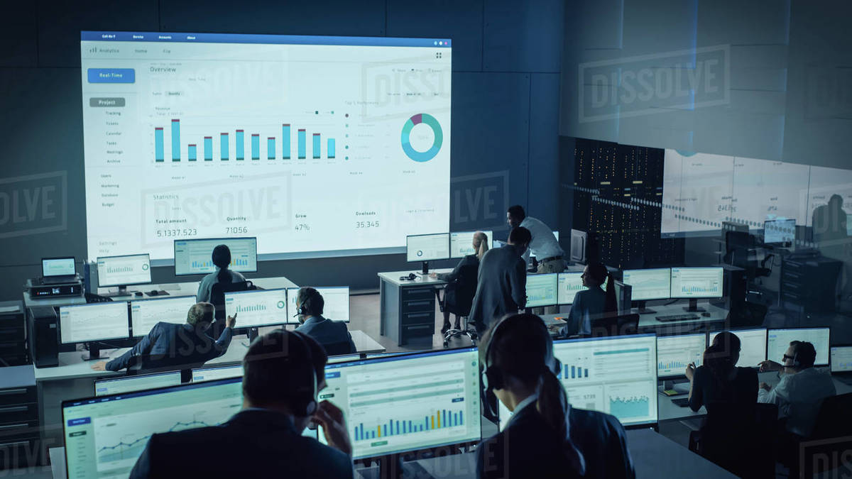 Professional Traders Working in a Modern Monitoring Office with Live ...