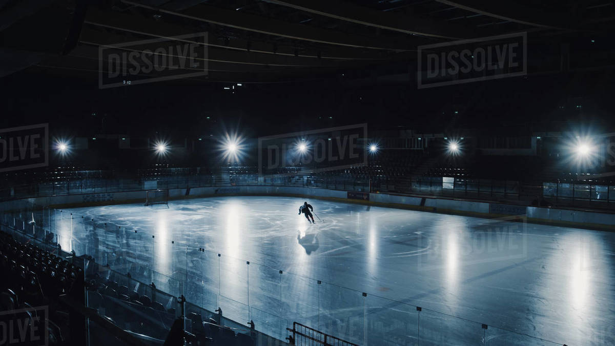 Ice Hockey Rink Arena: Professional Player Training Alone. Skates ...