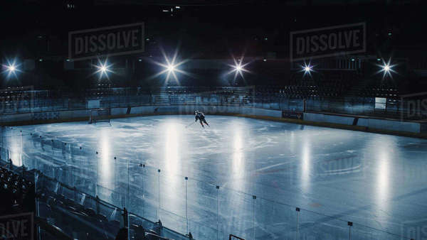 Ice Hockey Rink Arena: Professional Player Training Alone. Skates ...