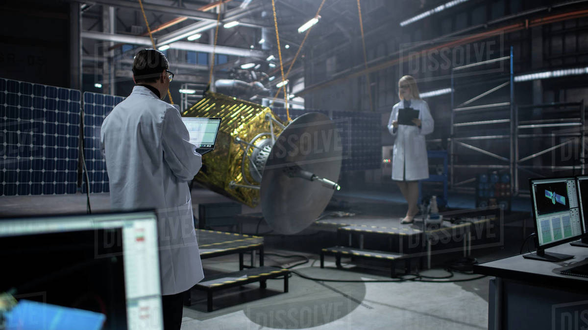 Engineer and Technician Working on Satellite Construction. Aerospace ...