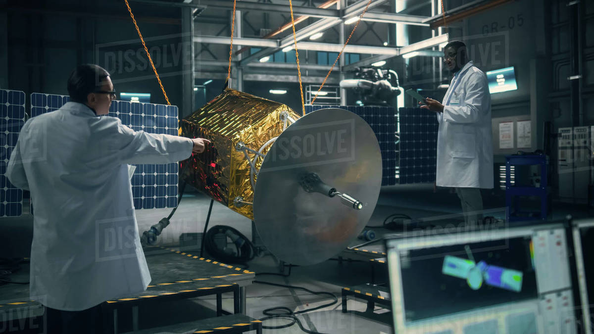 Engineer and Technician Working on Satellite Construction. Aerospace ...