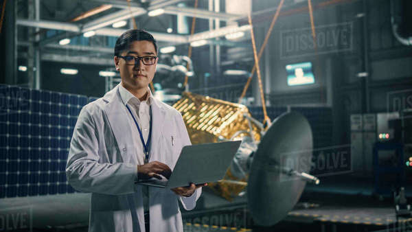 Portrait of Serious Asian Engineer Working on Artificial Satellite ...