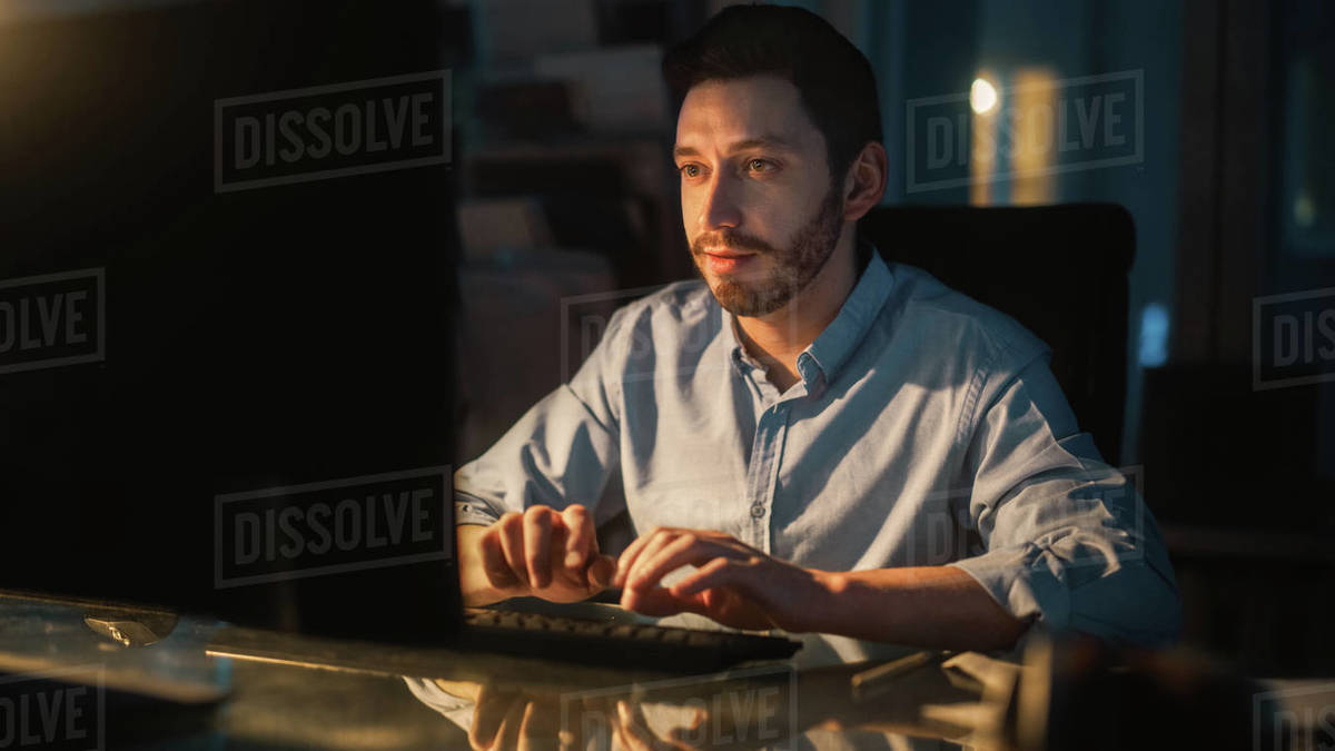 Manager Works on a Desktop Computer in Creative Agency in Dark Loft ...