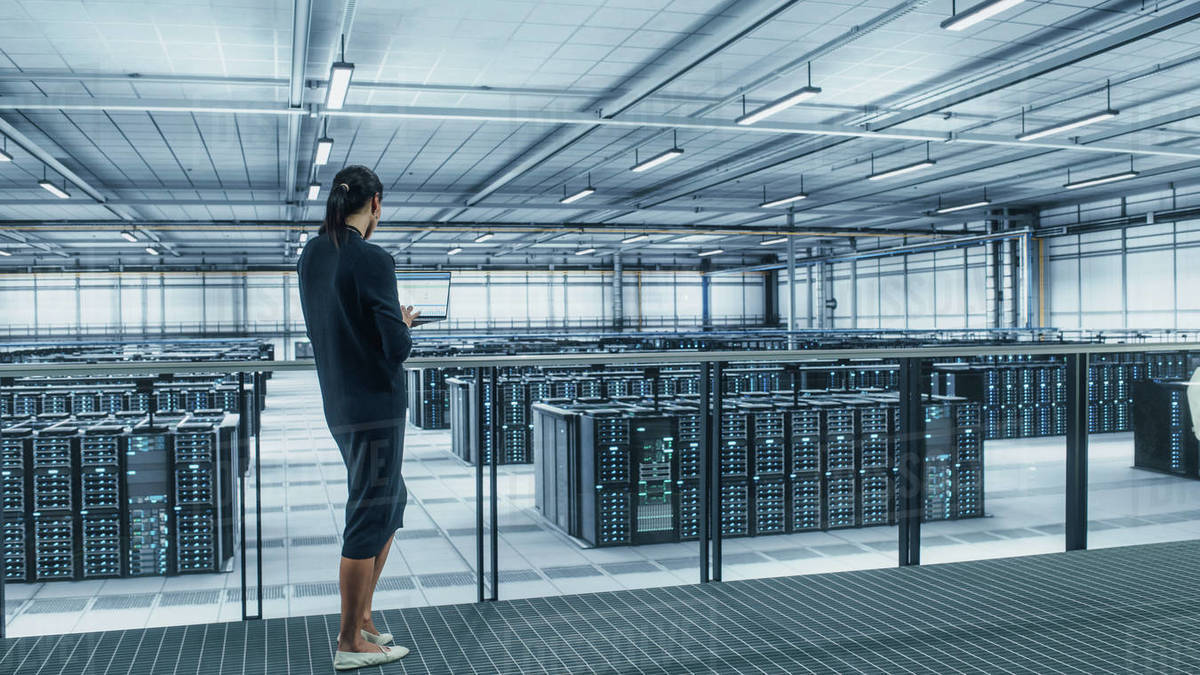 Data Center Engineer Using Laptop Computer - Stock Photo - Dissolve