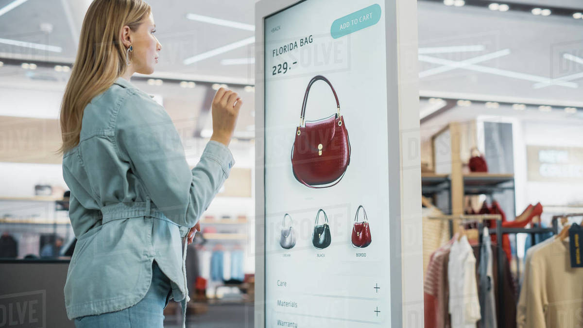 Female Customer Using Floor-Standing LCD Touch Display while Shopping ...