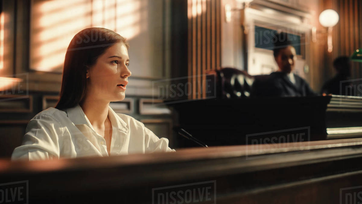 Female Witness Giving Evidence to Prosecutor and Defense Counsel ...