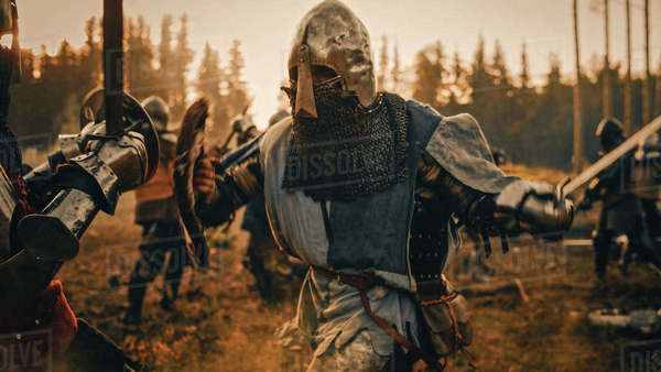 Epic Battlefield: Two Armored Medieval Knights Fighting with Swords ...