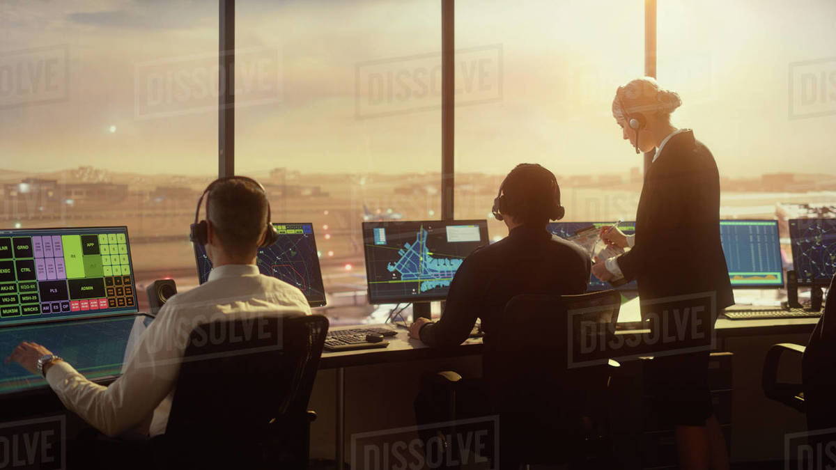 Diverse Air Traffic Control Team Working in a Modern Airport Tower at ...