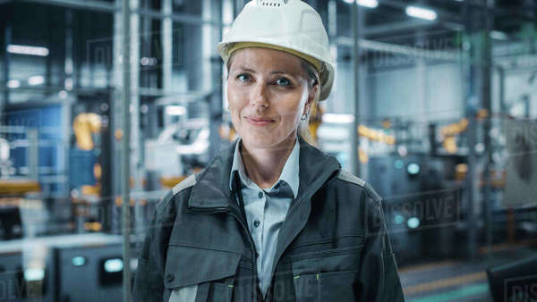 Portrait of Female Chief Engineer Wearing Hard Hat Looking at Camera ...