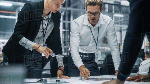 Young Diverse Team of Automotive Engineers Working in Office at Car ...