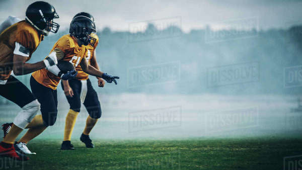 American Football Field Two Teams Compete - Stock Photo - Dissolve