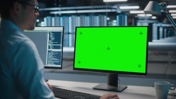 IT Specialist Administrator Working on Green Screen Chroma Key Computer ...