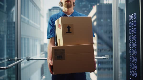 Young Delivery Person Riding Glass Elevator in Modern Office Building ...