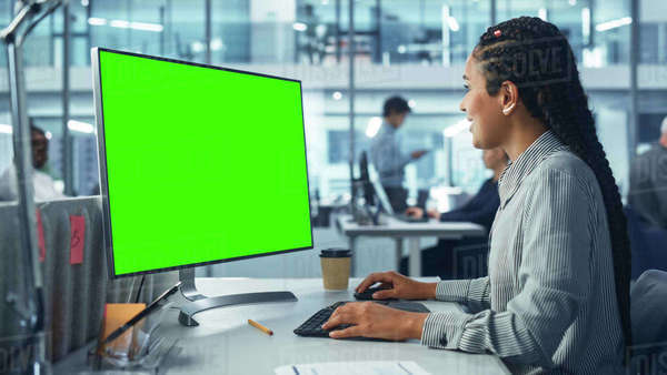 Female IT Technician Using Desktop Computer with Green Chroma Key ...