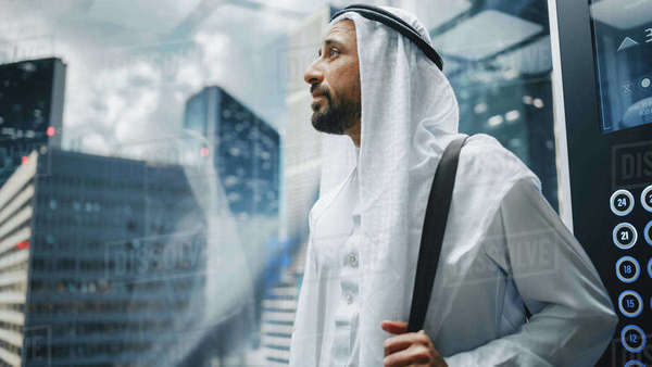 Successful Happy Muslim Businessman in Traditional White Kandura Riding ...