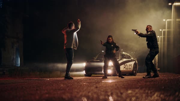 Two Police Officers Catch and Put Suspect Under Arrest. Cops Aiming ...