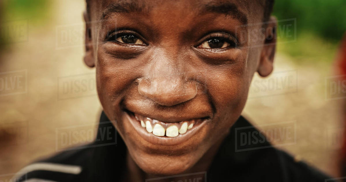Close Up Portrait of a Playful Authentic African Kid Looking at the ...