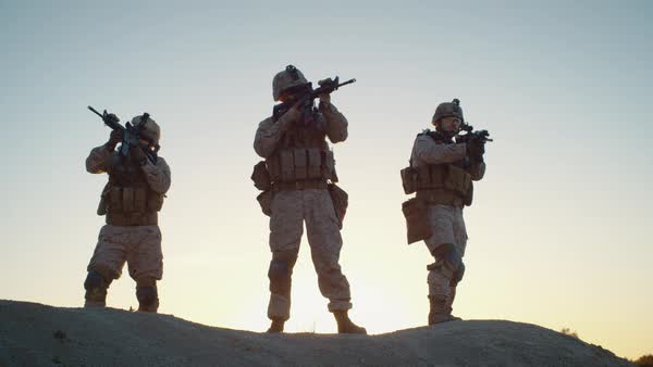 Squad of Three Fully Equipped and Armed Soldiers Standing on Hill in ...