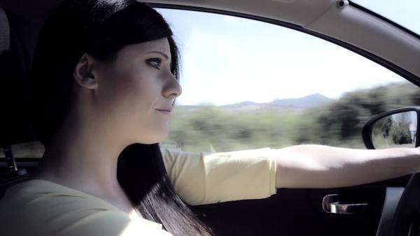 Sad woman in car driving, almost crying - Stock Video Footage - Dissolve