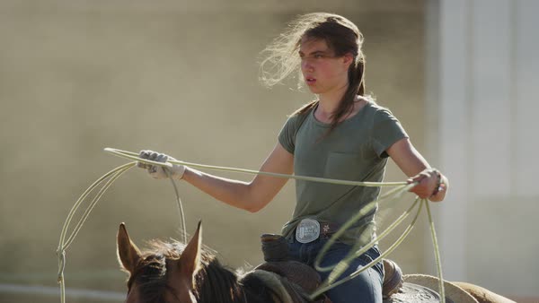Medium slow motion shot of girl on horse holding lasso - Stock Video ...