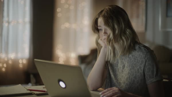 Girl falling asleep while studying on laptop at night / Cedar Hills ...