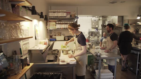 Men and women talking while working in restaurant kitchen - Stock Video ...