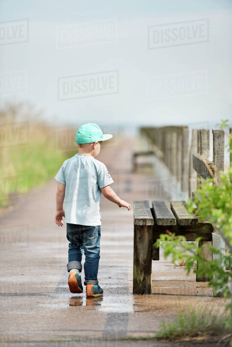 Boy walking - Royalty-free Stock Photo | Dissolve