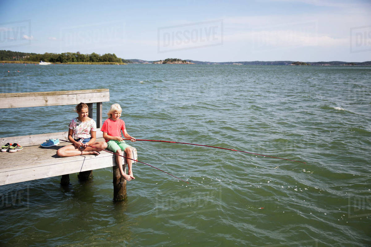 Boy and girl fishing - Royalty-free Stock Photo | Dissolve