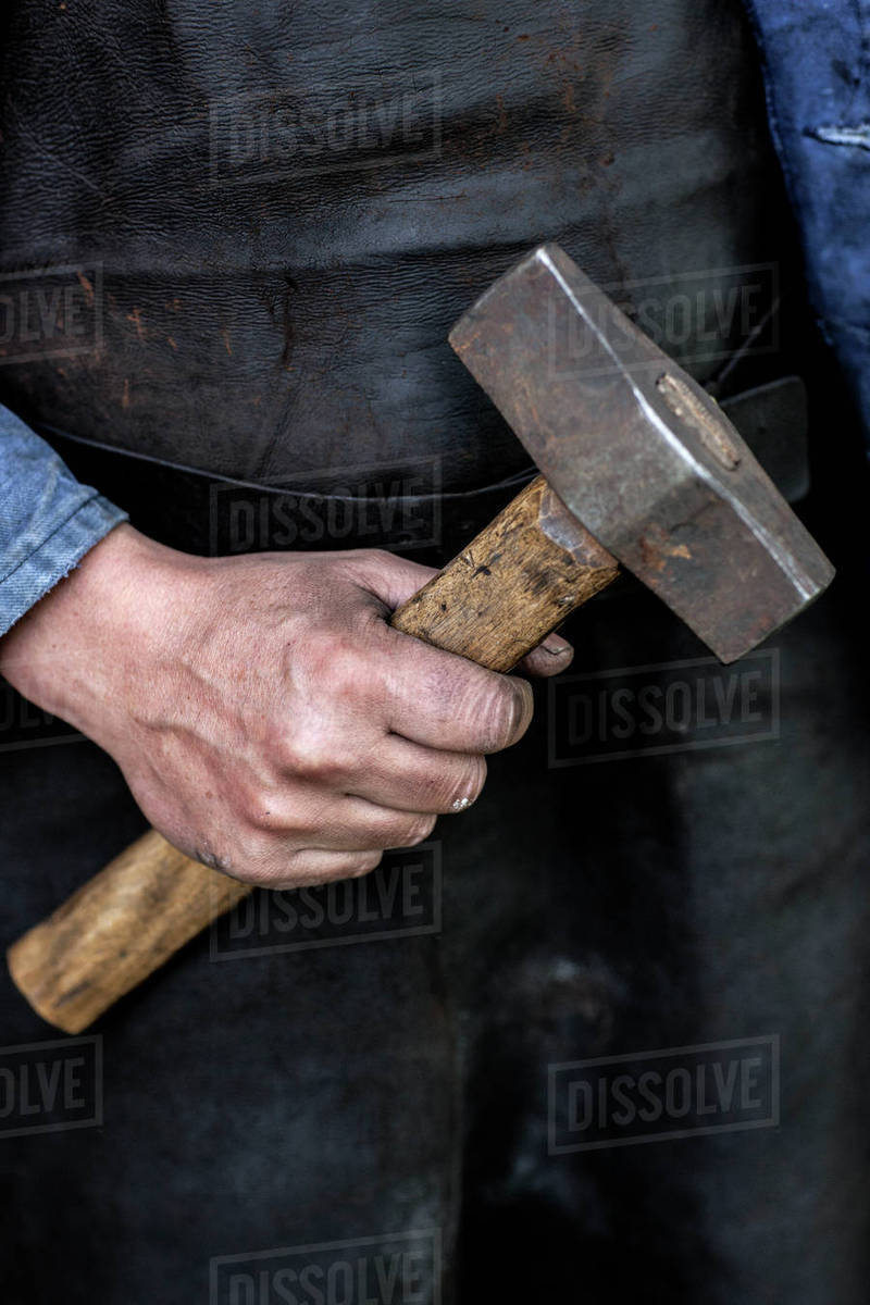 Hand with hammer - Royalty-free Stock Photo | Dissolve