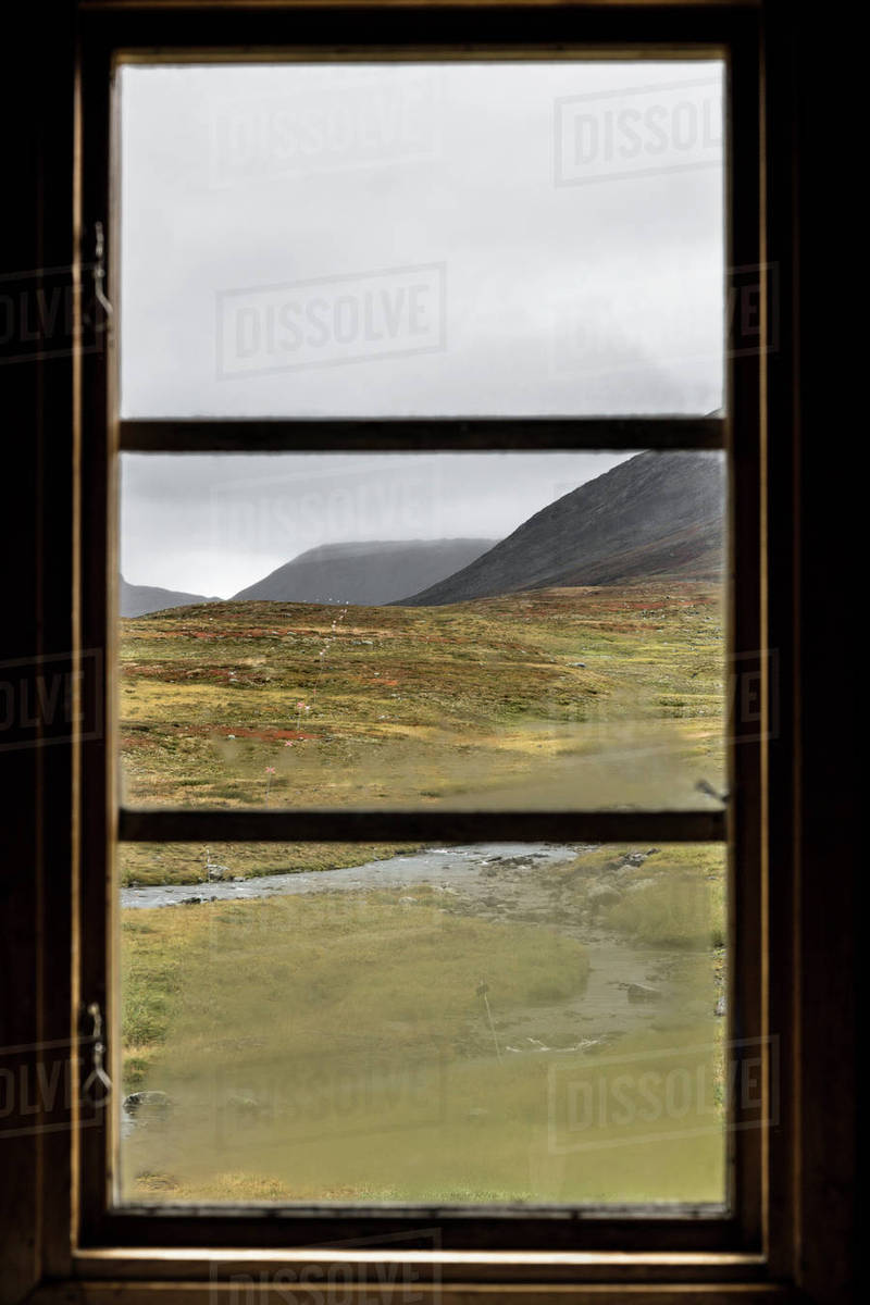 Mountains seen through window - Stock Photo - Dissolve
