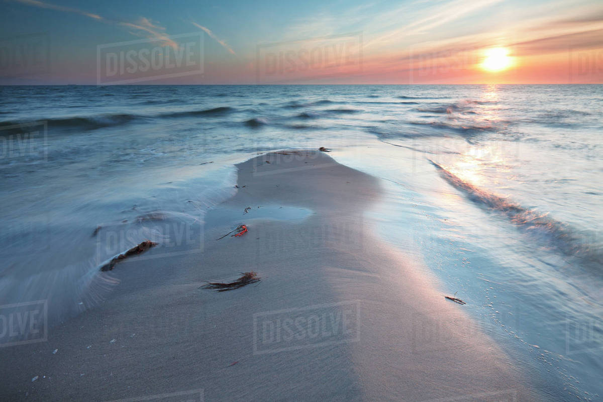 Sandy beach at sunset - Royalty-free Stock Photo | Dissolve