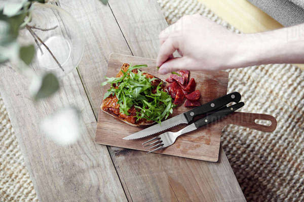 Hand putting rocket on toast - Royalty-free Stock Photo | Dissolve