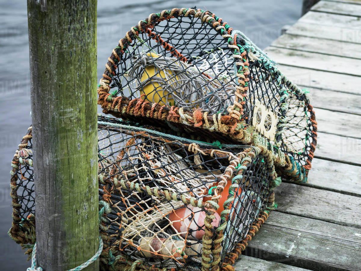 Lobster traps on jetty - Stock Photo - Dissolve